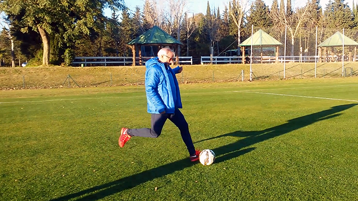 Club Director Győző Burcsa curls the ball into the goal from behind the ...
